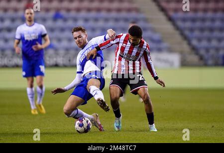 Sheffield United's Iliman Ndiaye, right, duels for the ball with ...