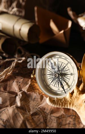 Golden compass and starfish on world map Stock Photo - Alamy