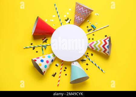 Party hats, confetti, straws and whistle on blue background Stock Photo ...