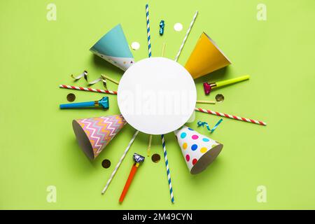Party hats, confetti, straws and whistle on blue background Stock Photo ...