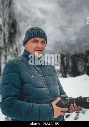 man photographing hold photo camera. photo of man photographing with ...