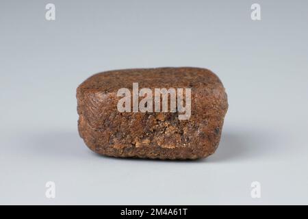 cannabis brown hashish closeup on gray background, moroccan hashish ...
