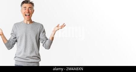Image of shocked and frustrated man spread hands sideways, shouting and ...