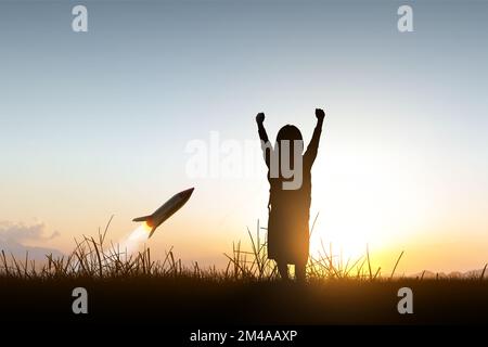 Rockets flying on the field with a sunset sky background. National ...