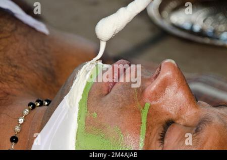 The make up of the Kathakali-character Jayantha step by step Stock ...