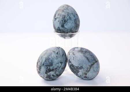 Defocus blue eggs. Close up Easter eggs pastel colored on white ...