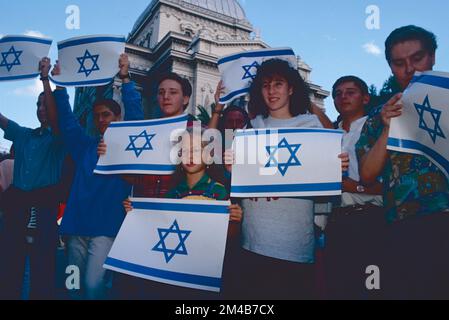 Italian Jews out the synagogue celebrating the reciprocal aknowledgment ...