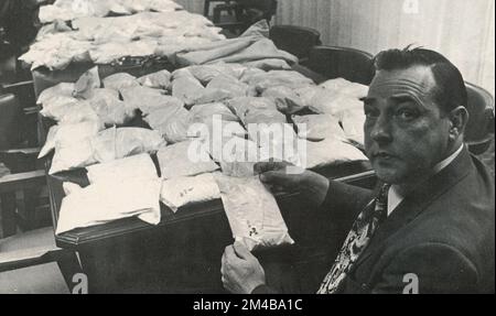 A Federal Bureau of Narcotics agent founding money from drug dealers ...