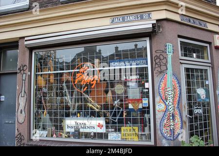 Showcase of instruments in store Stock Photo - Alamy