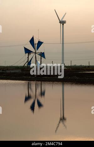 Ancient and new wind mill use for move the sea water into the salt ...