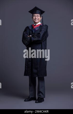 Senior Chinese student cheering for graduation Stock Photo - Alamy