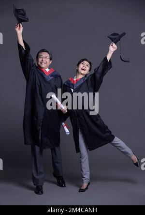 Senior Chinese students cheering for graduation Stock Photo - Alamy