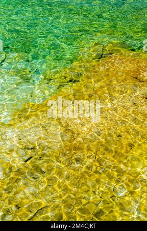 Sunlit water, rocks along the Lake Huron shoreline, Bruce Peninsula ...