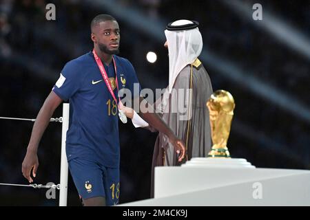 Award ceremony: UPAMECANO Dayot (FRA) walks past the trophy, cup ...