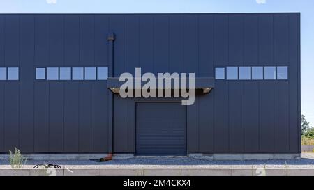 Closed Loading Door at New Black Warehouse Building Stock Photo - Alamy