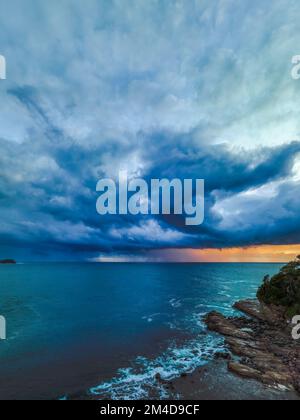 Aerial rainy day sunrise over the ocean at Avoca Beach on the Central ...