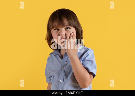 Cute little boy suffering from diarrhea, sitting on toilet. Child ...