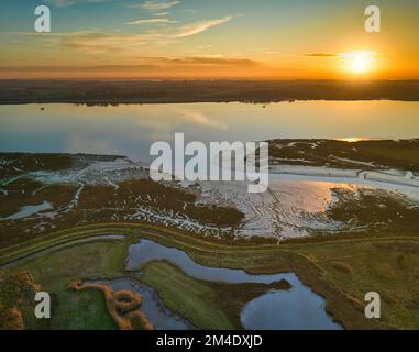The aerial view of Orwell river and fields under the blue sunset sky in ...