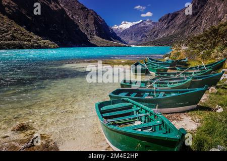 Llanganuco lake with boats in Cordillera Blanca, snowcapped Andes ...