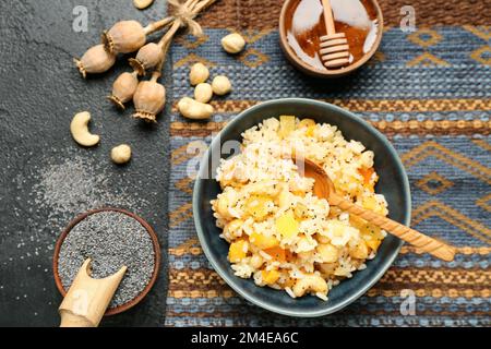 Bowl of rice Kutya, ingredients and poppy pods on dark background Stock ...