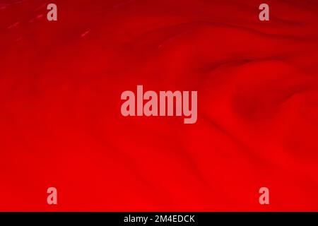 Red liquid, waves, fluidity Stock Photo - Alamy