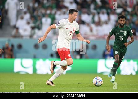 Saudi Arabia's Sami Al-Najei (C) heads a ball during the AFC Asian Cup ...