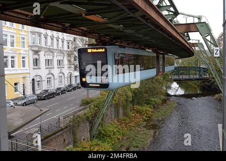 The unusual hanging monorail train knwn as the Schwebebahn, in ...