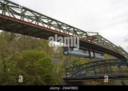 The unusual hanging monorail train knwn as the Schwebebahn, in ...