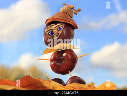 cute chestnut figure with hat Stock Photo - Alamy