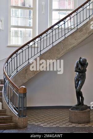 Foyer with free-swinging Art Nouveau staircase and Auguste Rodin's Eva ...