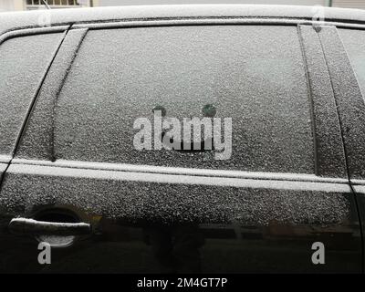 smiley in snow on car window Stock Photo - Alamy