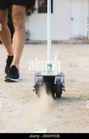 Clean sweeping a tennis court Stock Photo - Alamy