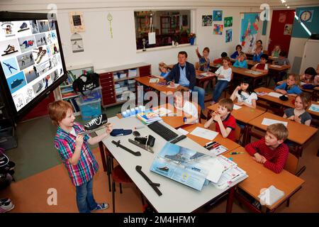 Netherlands, at primary school a boy is giving a lecture on speed ...