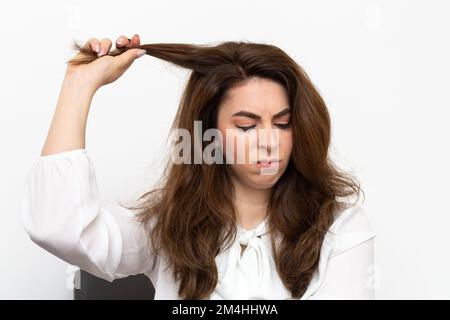Young woman suffering from trichotillomania, a compulsive psychological ...