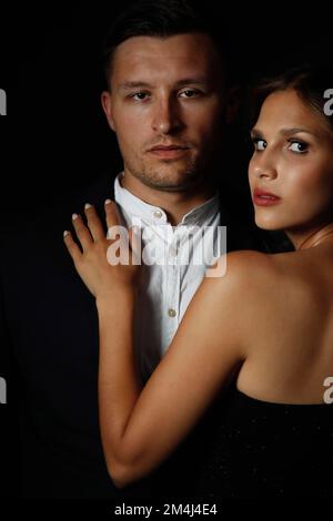 Woman put her hand on the man's shoulder Stock Photo - Alamy