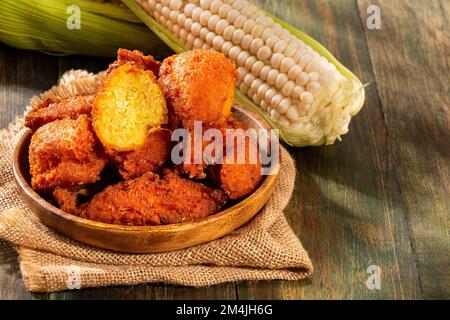 Fried tender corn croquettes - Colombian traditional food Stock Photo ...