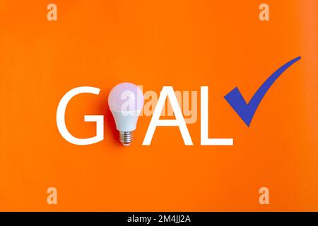 light bulb idea. Goal lettering created from led bulb on colored ...