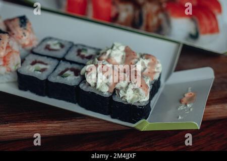 Beautiful delicious sushi. Sushi delivery. Advertising sushi rolls made ...