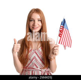 Young woman with USA flags showing something on grey background Stock ...