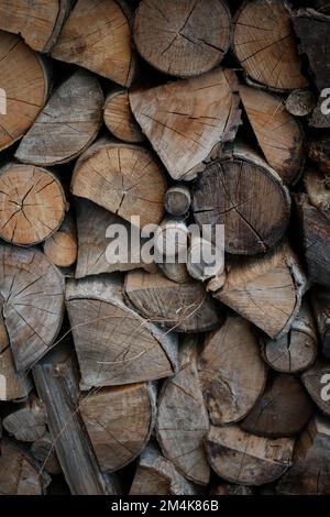 A vertical shot of cut firewood - wallpaper of cut tree branches and ...