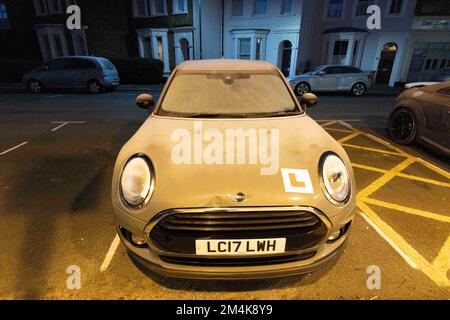 Cars parked along roads around Teddington are covered in frost. Image ...