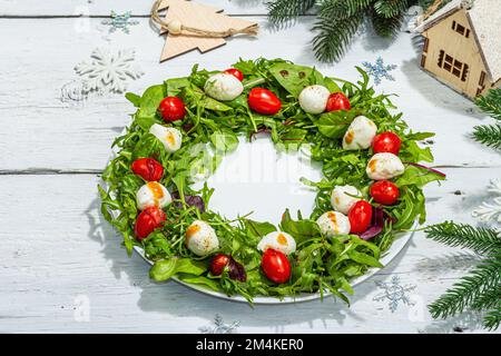 Charcuterie wreath with Christmas decorations. Fashionable snack ...