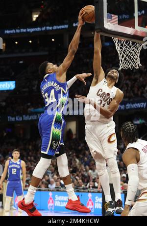 Cleveland Cavaliers center Jarrett Allen, right, dunks in front of ...