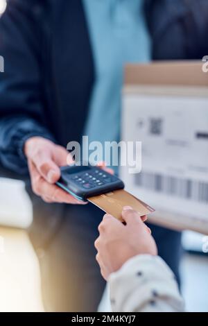Payment is as easy as that. an unrecognizable delivery man receiving ...