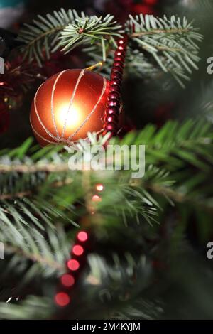 Orange glitter Christmas ball found in a natural tree Stock Photo - Alamy