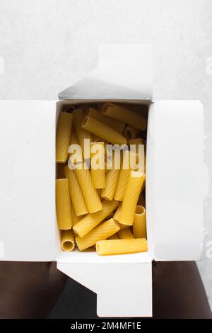 Flat lat of uncooked tortiglioni pasta shells, top view of tortiglioni ...