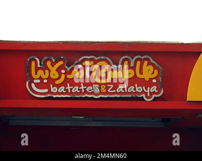 Cairo, Egypt, December 10 2022: Batates and Zalabya or potatoes and ...