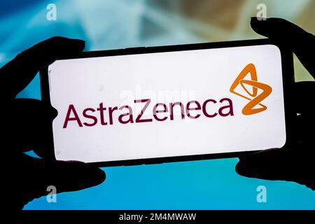 In this photo illustration a Astra Zeneca logo seen displayed on a ...