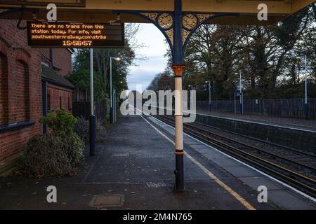 A deserted platform and a sign announcing that there are no trains at ...