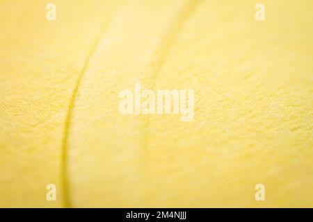 Extreme macro of embossed yellow paper. Selective focus, shallow depth ...